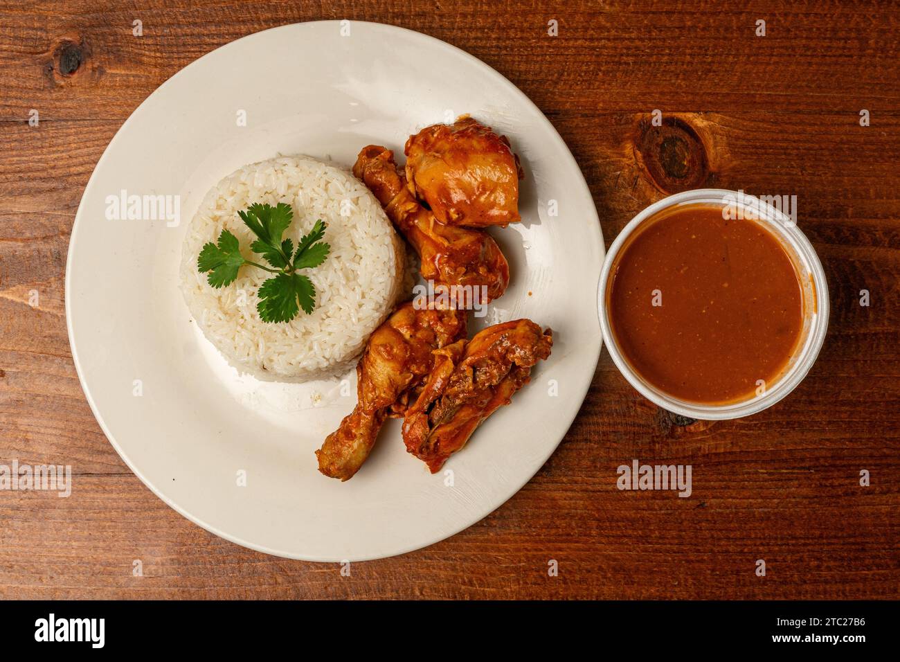 Chicken wings with rice and beans Stock Photo - Alamy