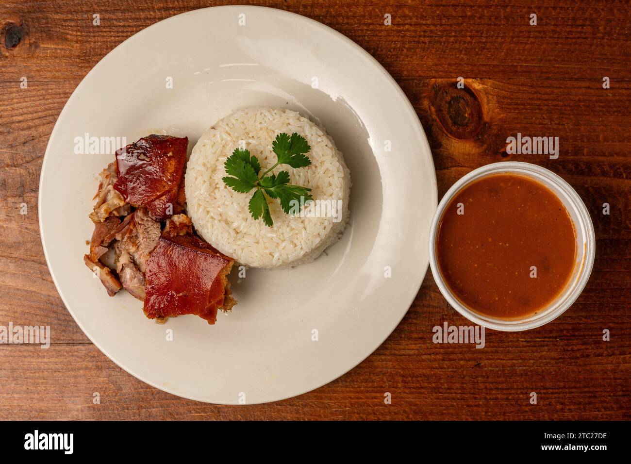 Fried pork with white rice with beans Stock Photo - Alamy