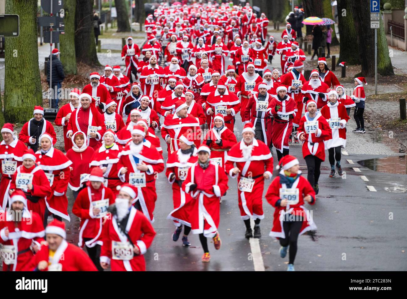 Participants dressed in Santa Claus costumes, or St. Nicholas costumes ...