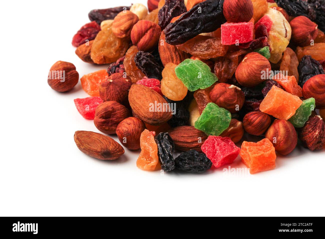 Nuts and candied fruits in bulk on a white background Stock Photo - Alamy