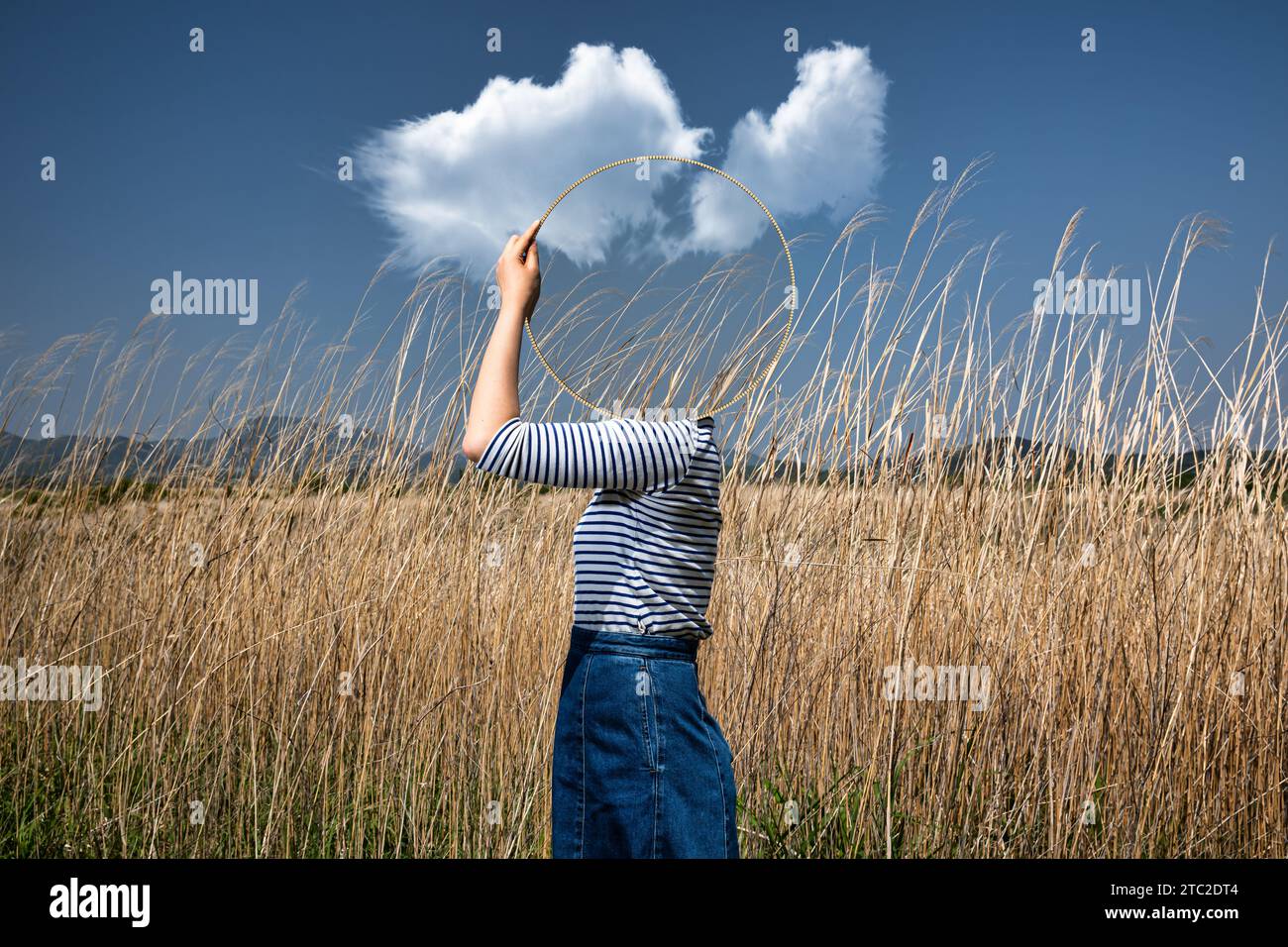 Surrealism with a woman holding a mirror and covering her face in the ...