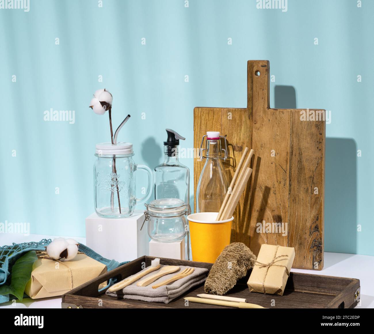 Eco-friendly items are placed in front of a mint color background Stock ...