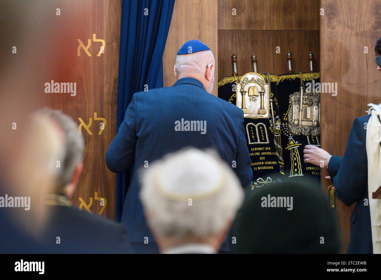 Magdeburg, Germany. 10th Dec, 2023. Jewish men close the Torah closet ...