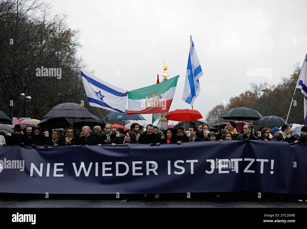 10 December 2023, Berlin: Participants in a demonstration protest ...