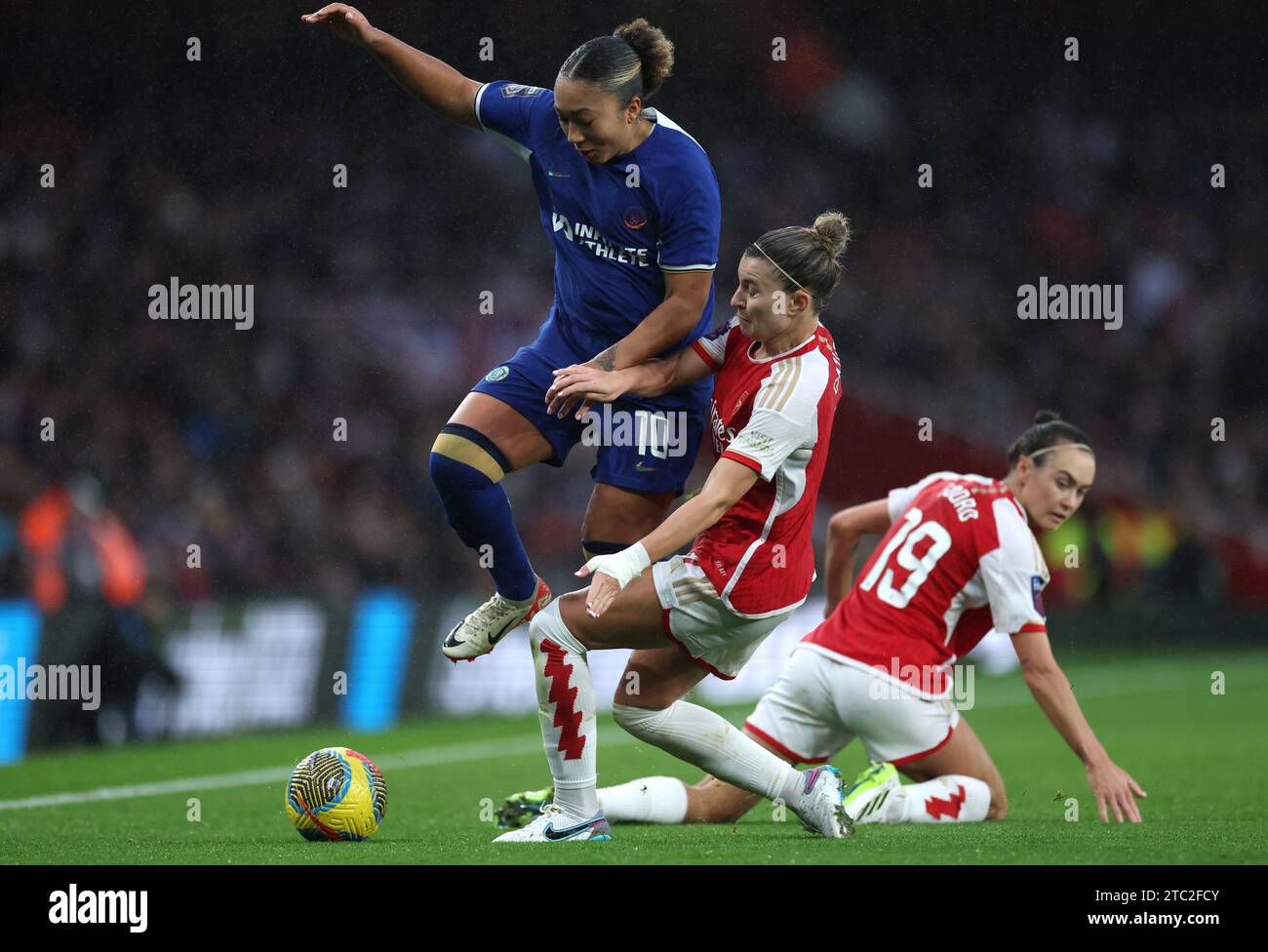 Chelsea's Lauren James tackled by Arsenal's Steph Catley and Caitlin ...