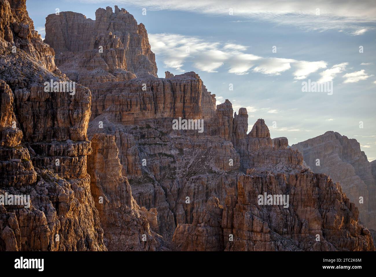 Sunlight at sunrise on the mountain walls of the Brenta Dolomites ...