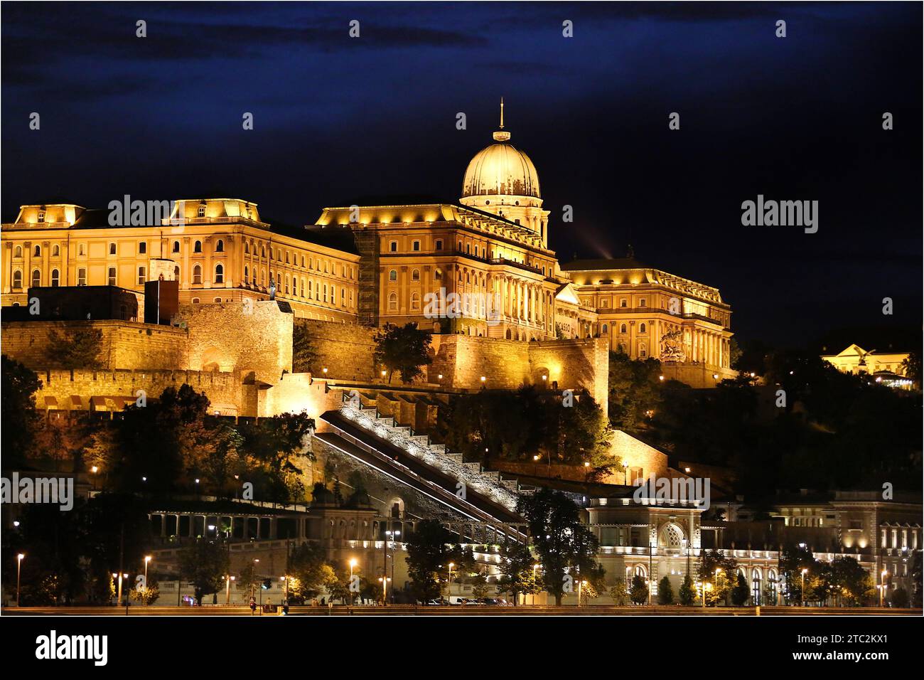Night view of the enlightened Buda Castle (Budavári Palota) from the Danube River, Budapest ...