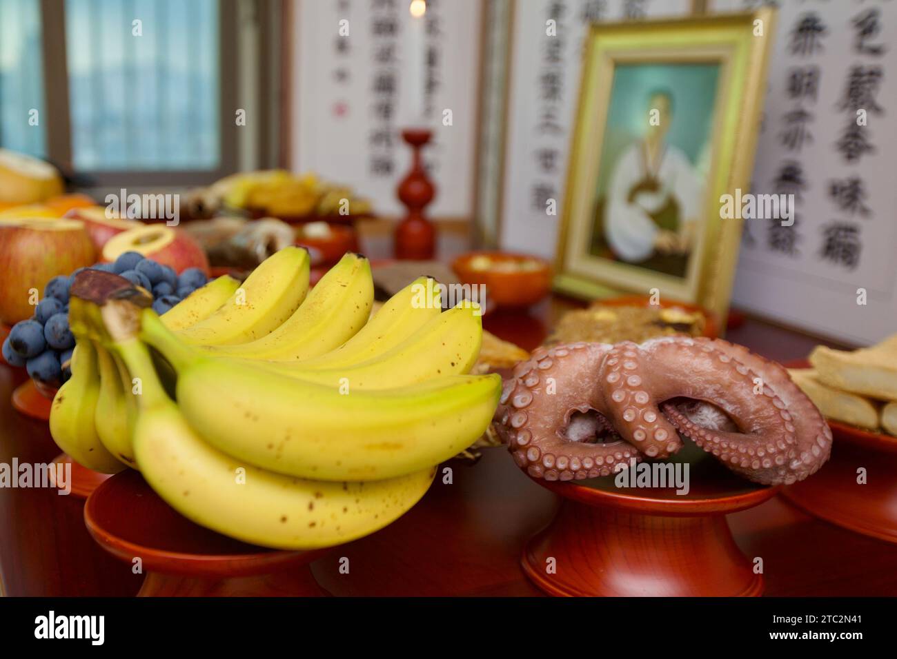 In a Korean living room, a Charye table is set with an array of ...