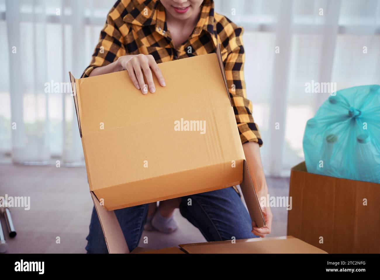 Women picking and sorting waste cardboard box to reuse and recycling ...