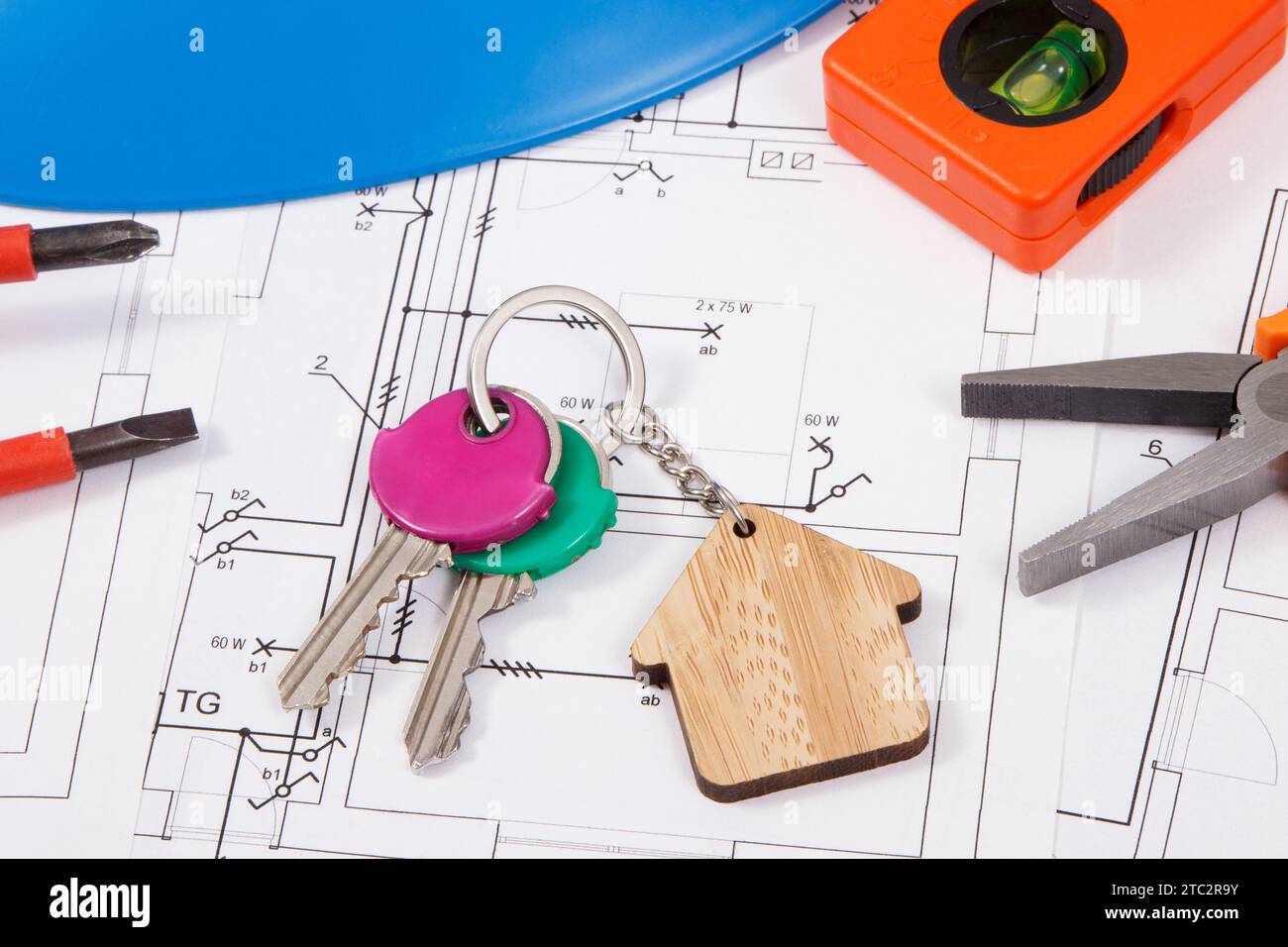 House keys, electrical construction diagrams or blueprint and work ...