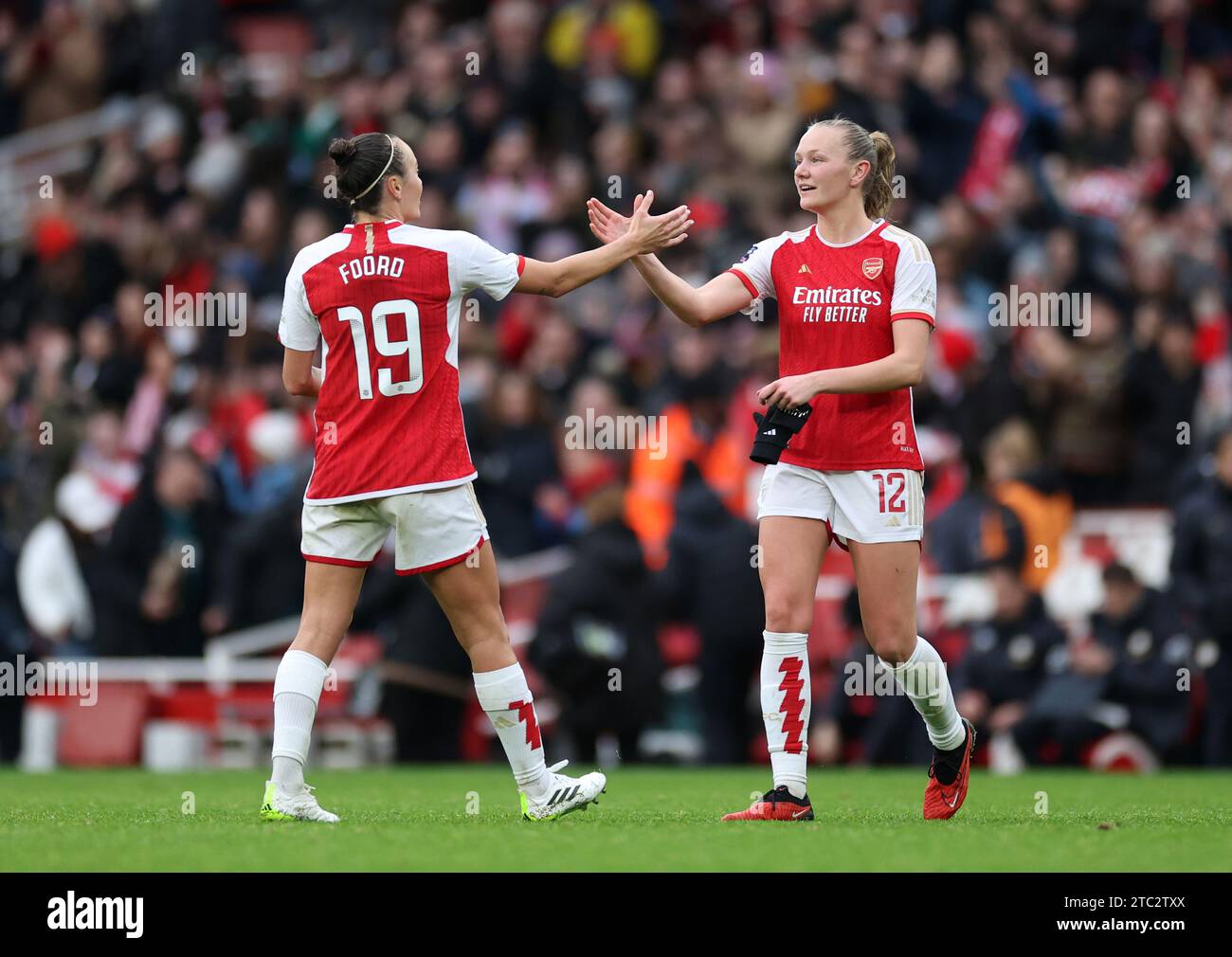 Arsenal's Caitlin Foord (left) and Frida Maanum celebrate following the ...