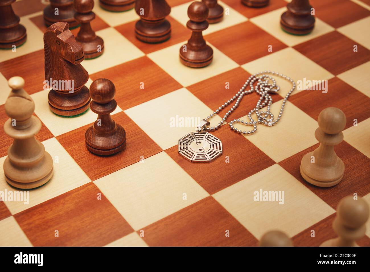 Buddhist religious symbol of yin and yang with chess pieces of kings on ...