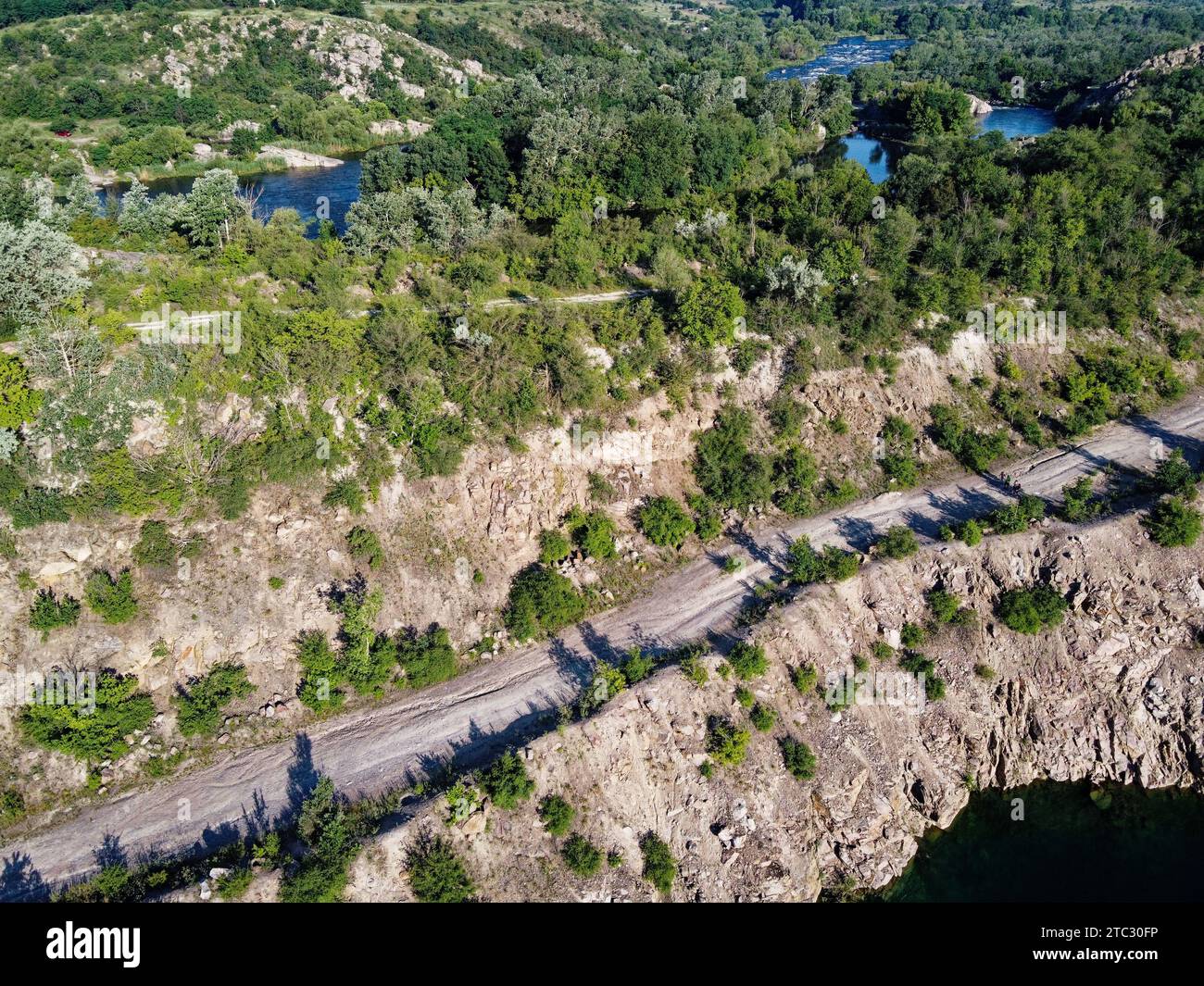 Rocky terrain overgrown with sparse vegetation, aerial view. Summer ...