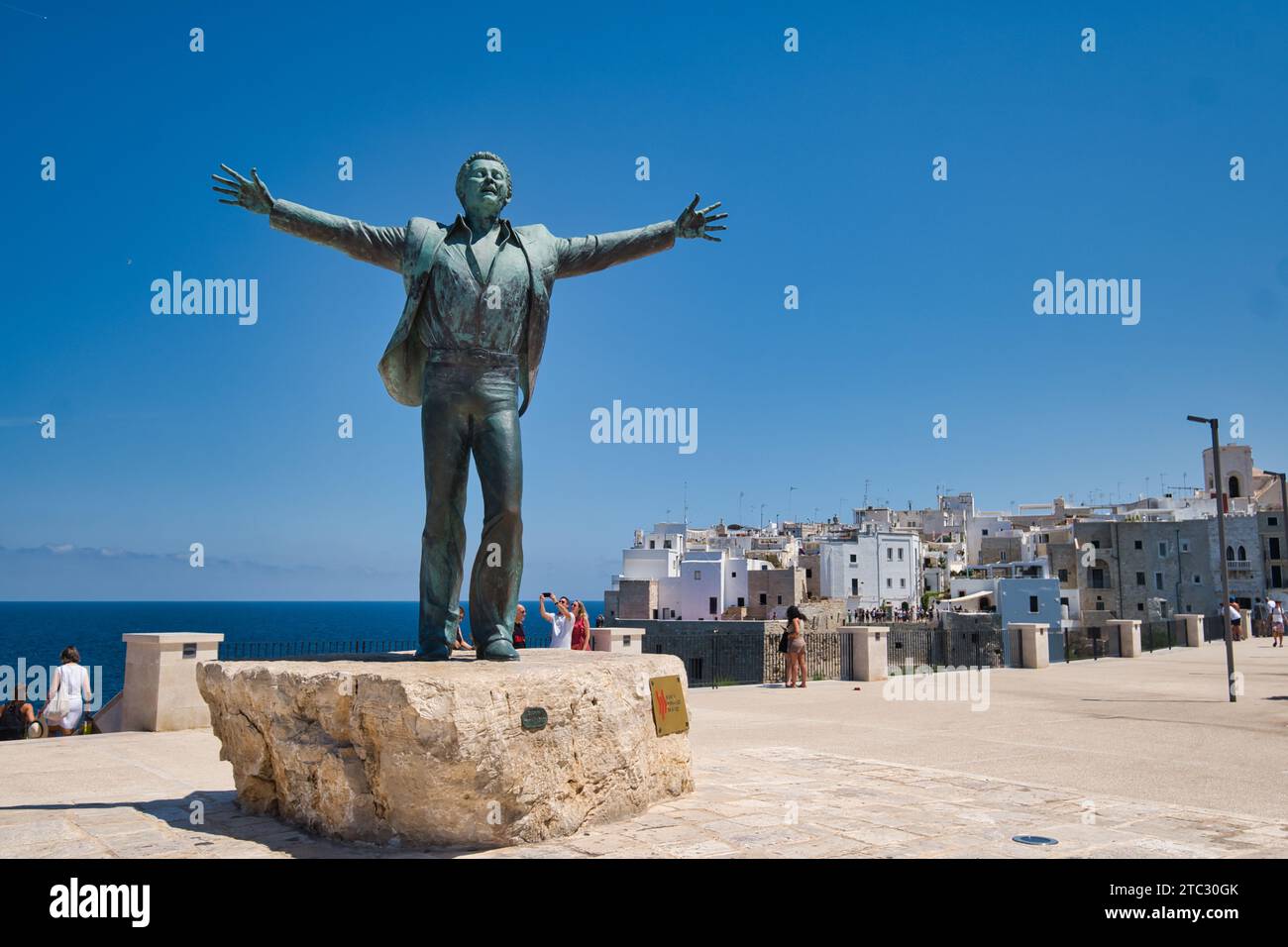 View of the Domenico Modugno bronze statue in Polignano a mare Stock ...