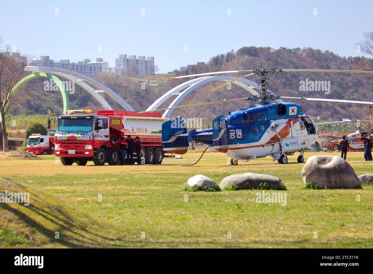 A Korean firefighting helicopter is captured mid-refueling at Taehwa ...