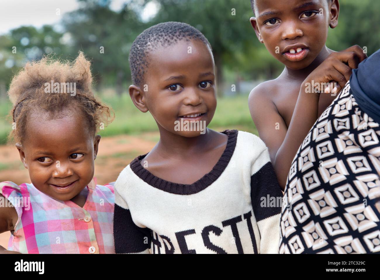 Portrait three young siblings outdoors hi-res stock photography and ...