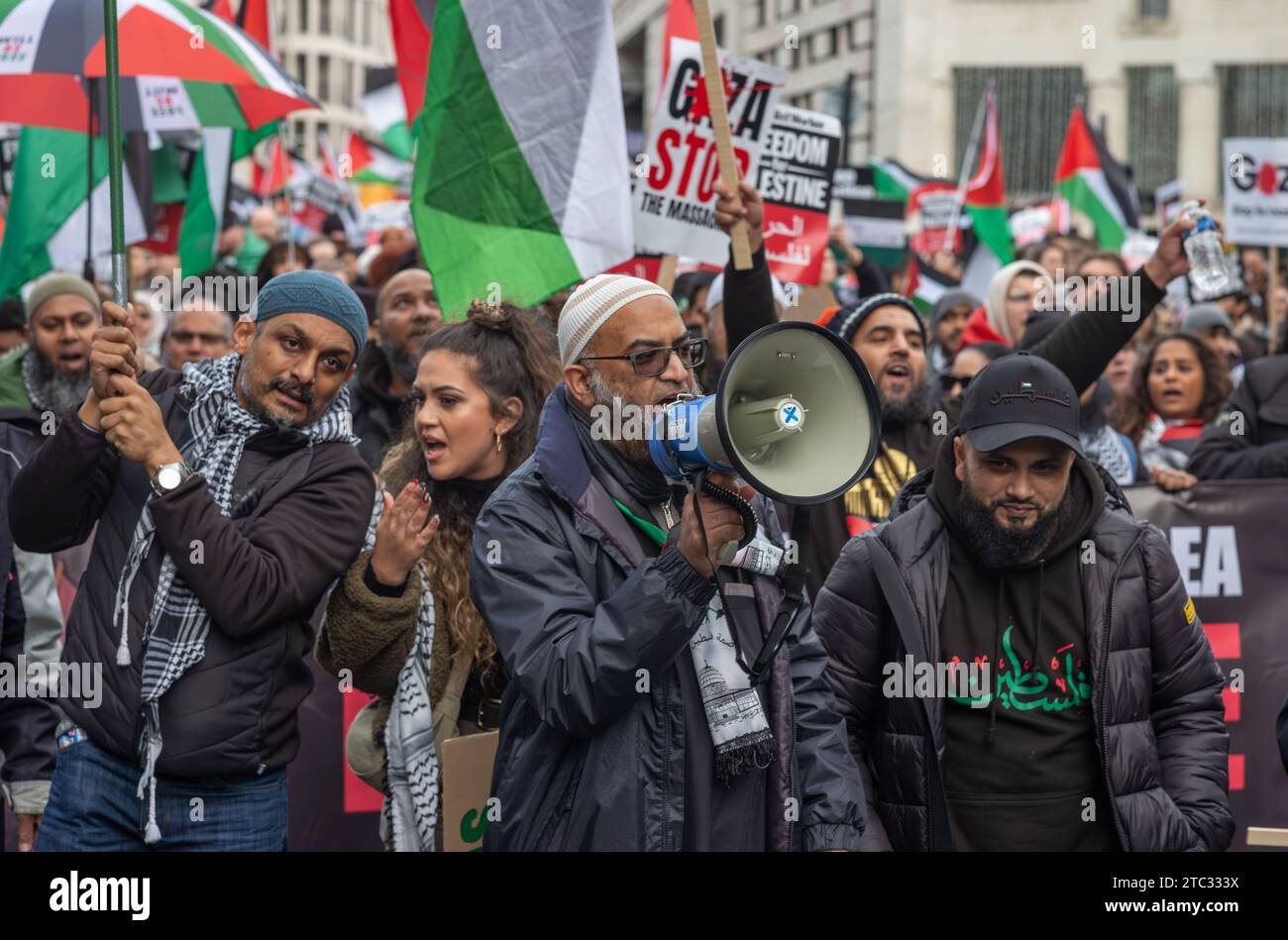 London / UK - Dec 9 2023: A pro-Palestinian muslim protesters uses a ...
