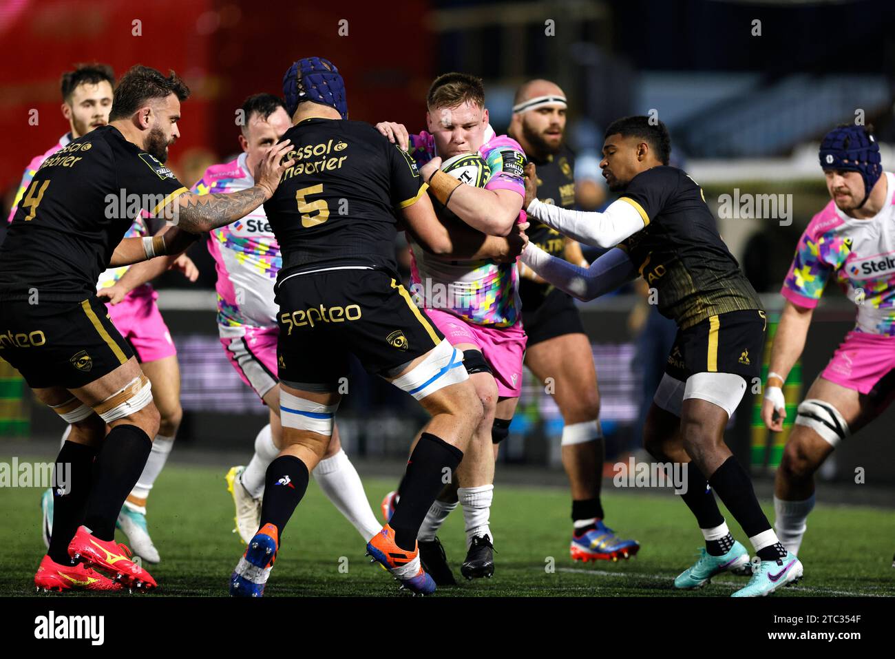 Newcastle Falcon's Freddie Lockwood (centre) attempts to get past ...
