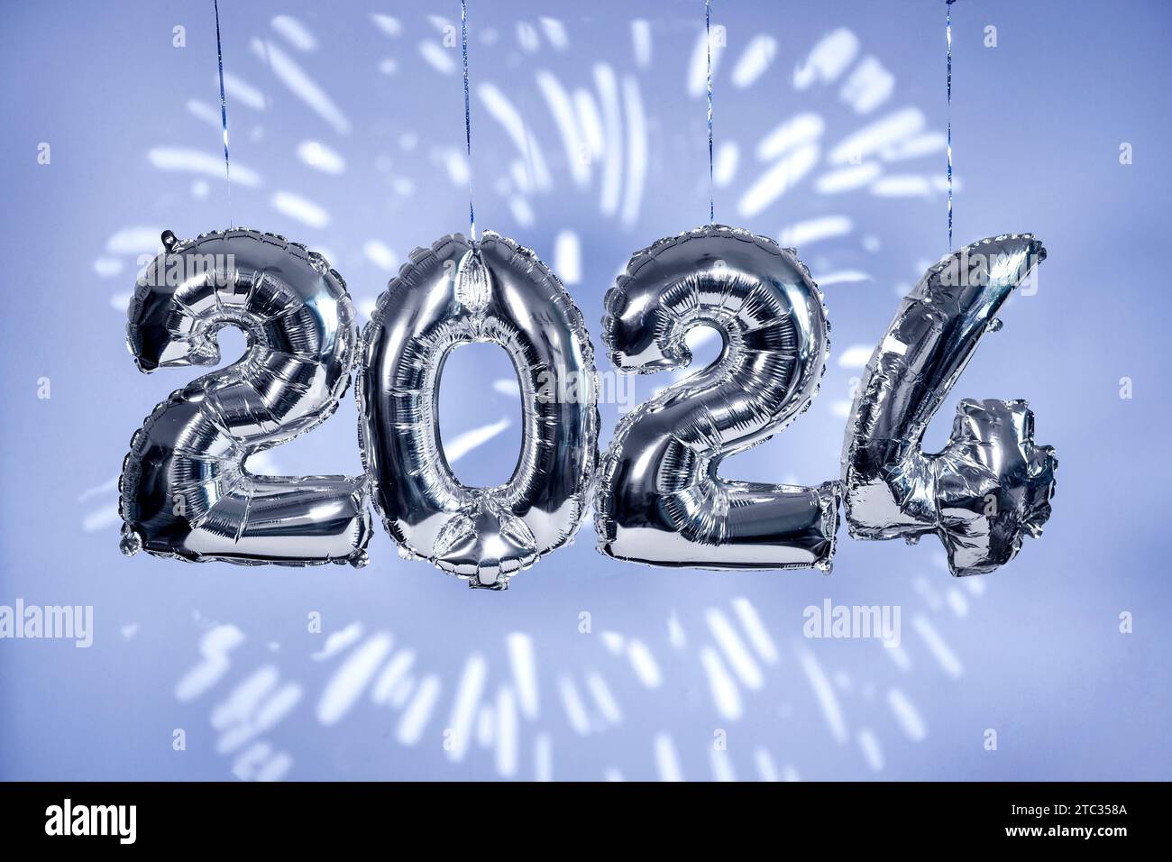 Silber foil balloons in numbers shape 2024 Stock Photo - Alamy