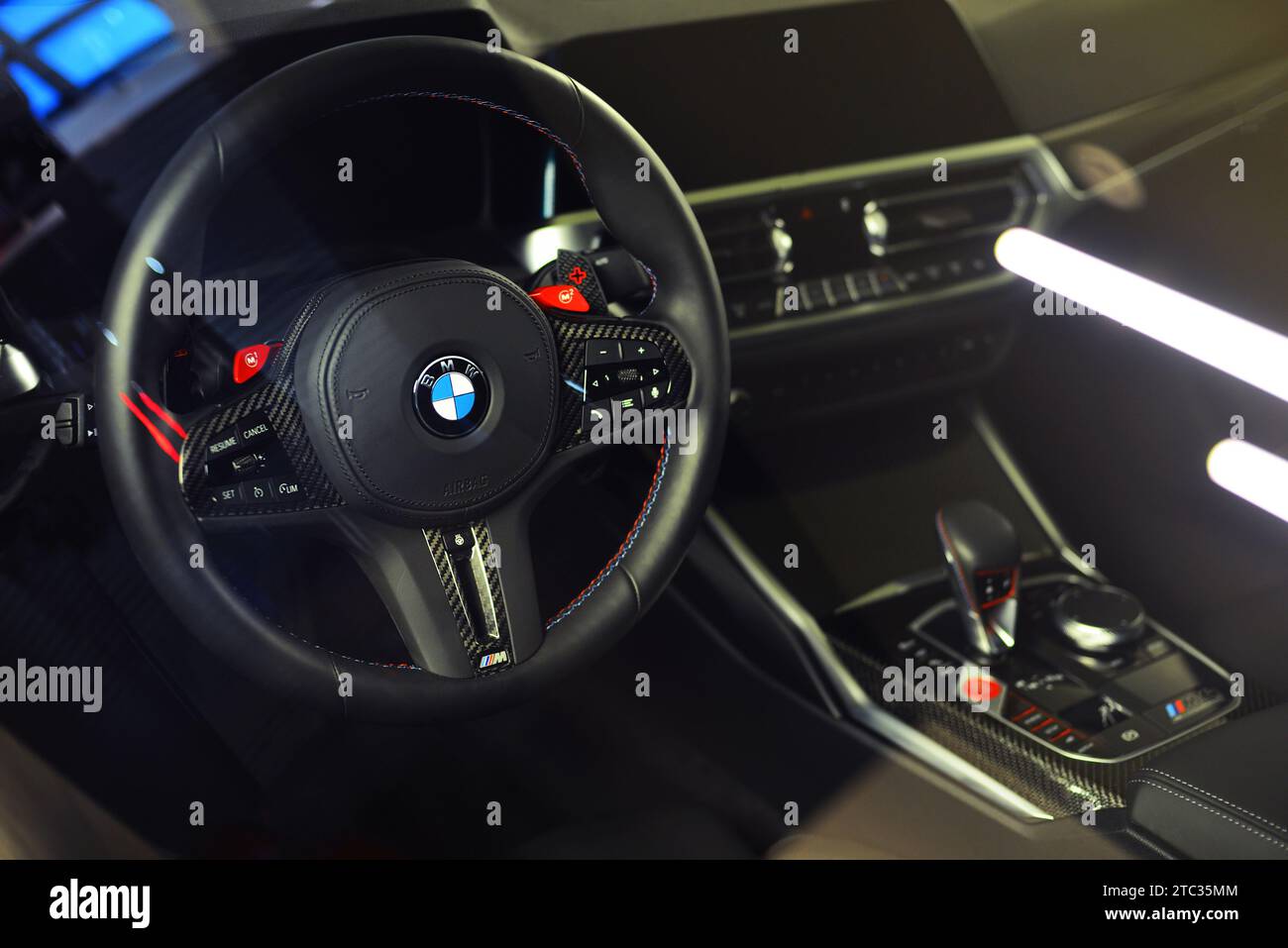 BMW M4 Competition. Brand new sport coupe car, the drivers seat with a steering wheel Stock ...