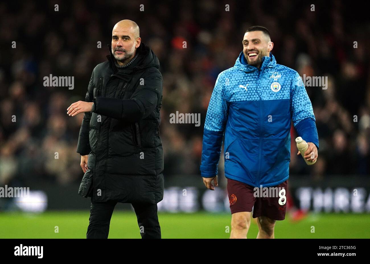 Manchester City manager Pep Guardiola (left) and Manchester City's ...
