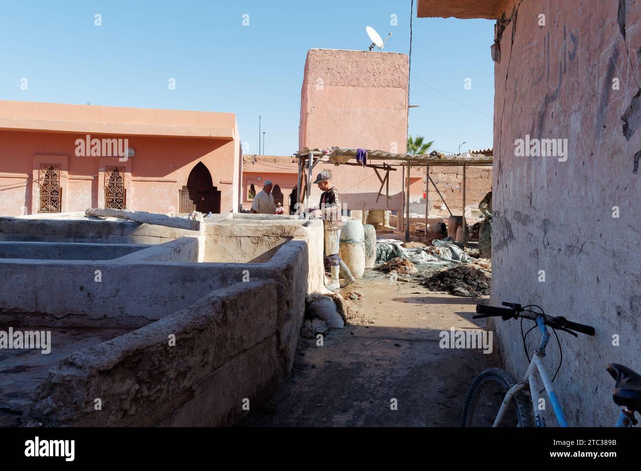 Worker at the Tannery in the city of Marrakesh aka Marrakech with ...