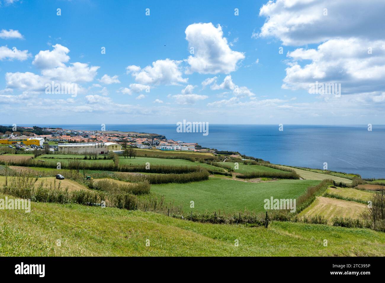 Azores landscape: expansive green fields leading to small mountains ...
