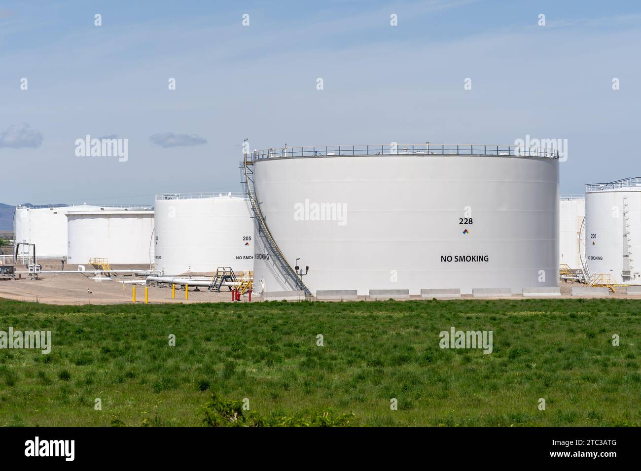 Oil Tanks with blue sky are shown Stock Photo - Alamy