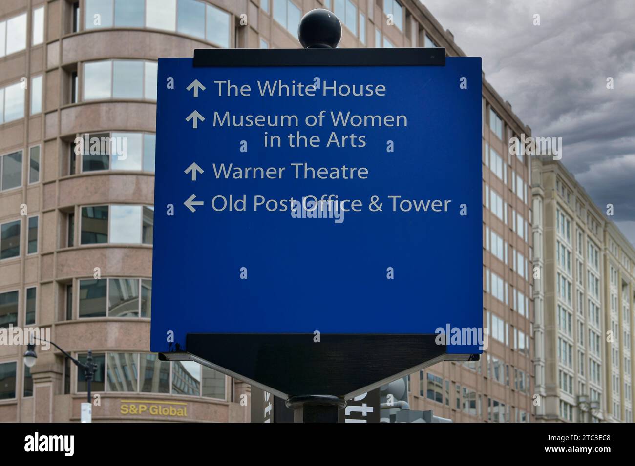Tourist street sign pointing with arrows to multiple landmarks in ...