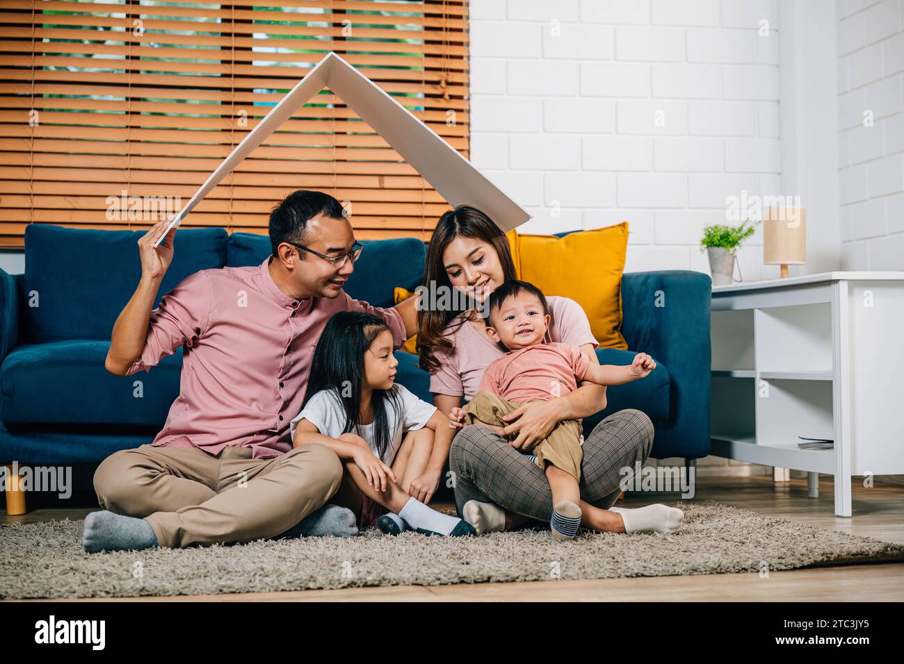 Concept of housing and relocation takes shape with happy family mother ...