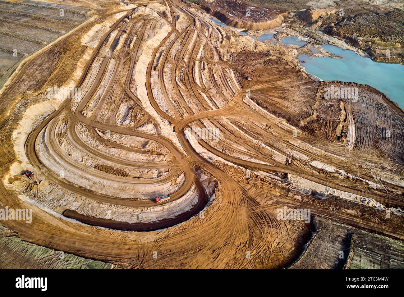 Aerial view of the patterns of roads on a sand quarry. Extraction of ...