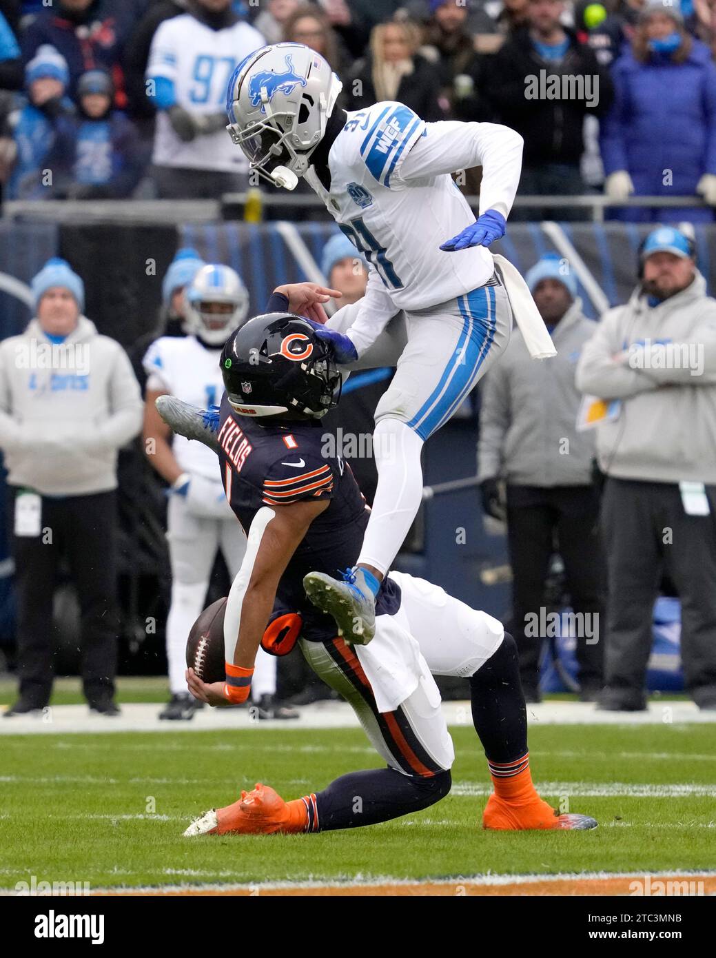 Detroit Lions safety Kerby Joseph leaps into the air to avoid hitting a ...