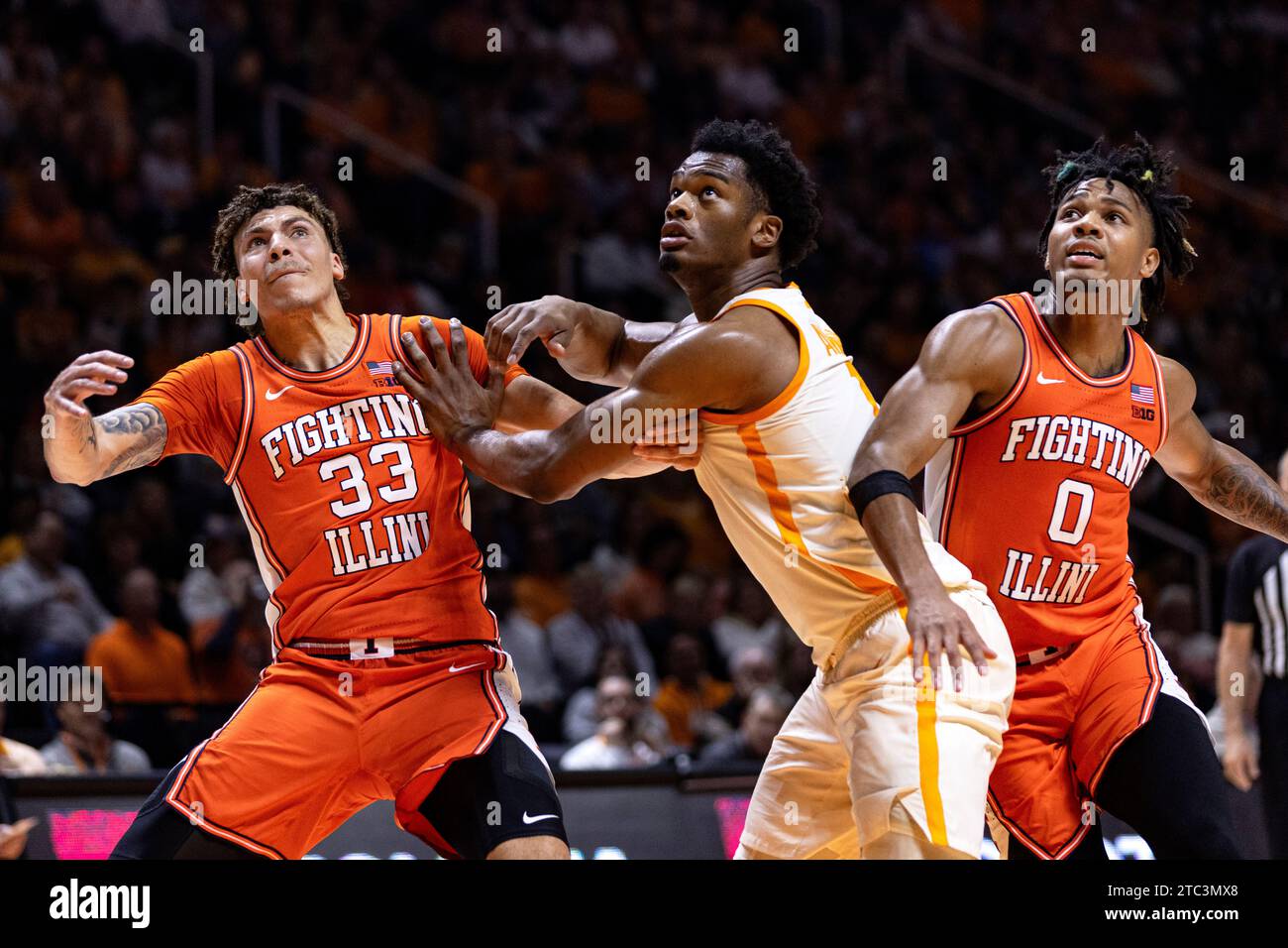 Tennessee forward Tobe Awaka (11) battles for the ball with Illinois ...