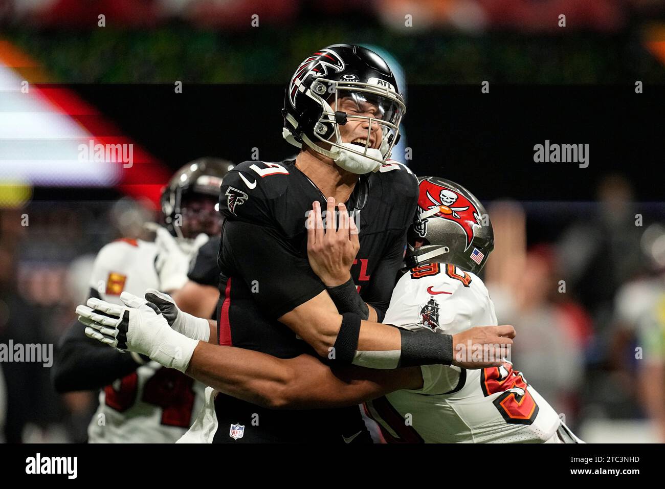 Atlanta Falcons quarterback Desmond Ridder (9) is hit by Tampa Bay ...