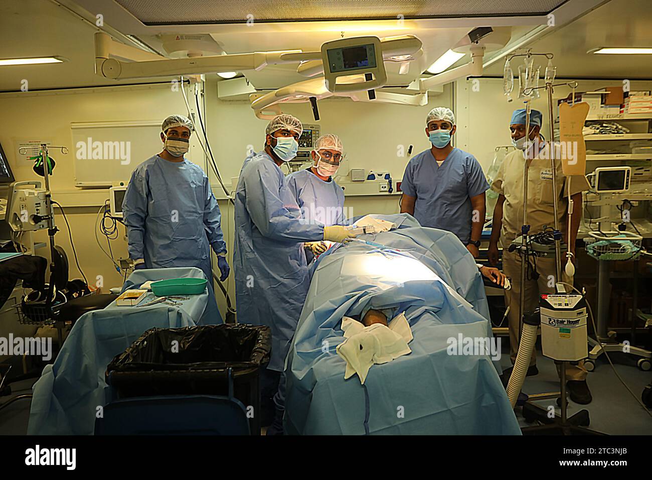 Rafa, Gaza. 09th Dec, 2023. A team of surgeons performs surgery on a ...