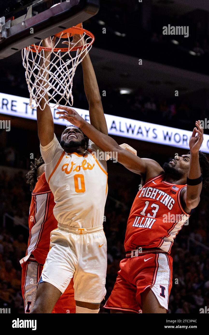 Tennessee forward Jonas Aidoo (0) goes for a dunk past Illinois forward ...