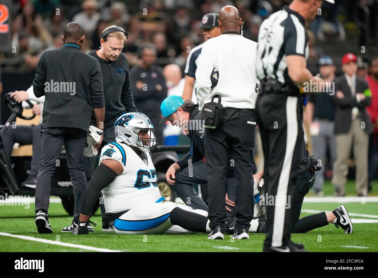 Carolina Panthers guard Justin McCray is treated on the field after ...