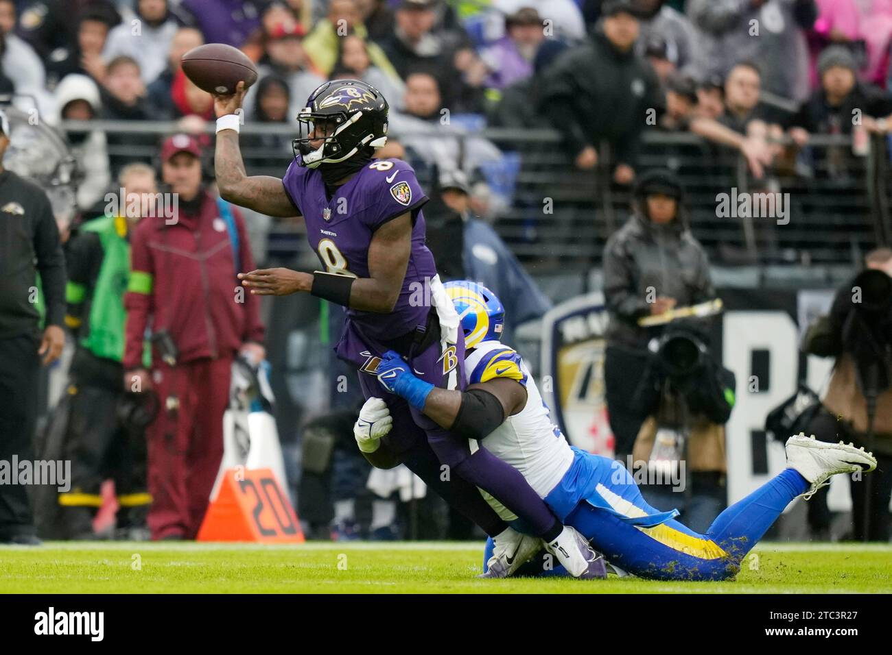 Los Angeles Rams defensive tackle Kobie Turner, right, takes down ...