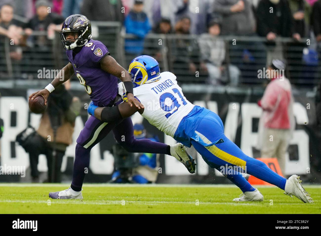 Los Angeles Rams defensive tackle Kobie Turner (91) tackles Baltimore ...