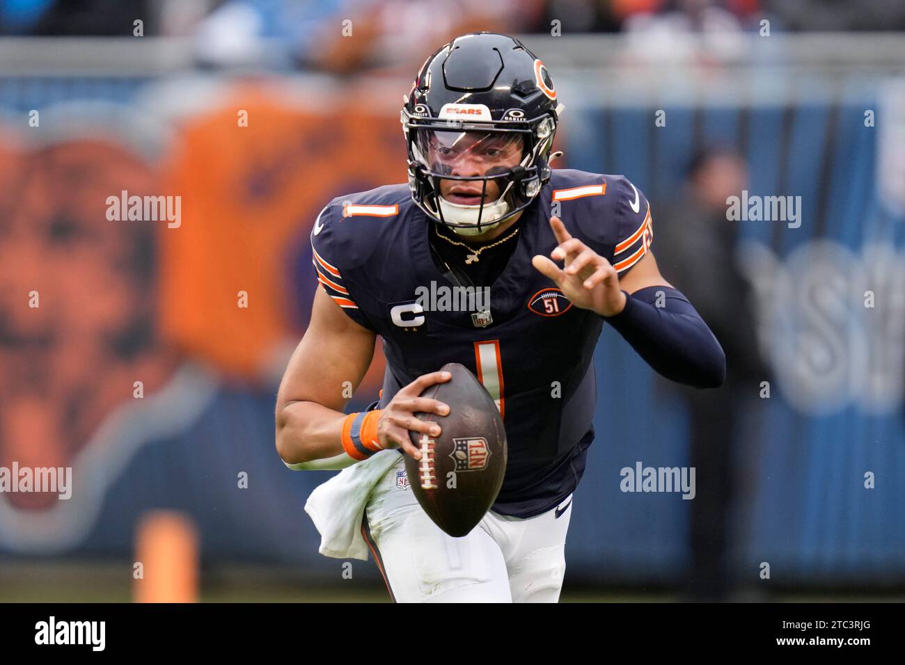 Chicago Bears quarterback Justin Fields signals to a teammate during ...