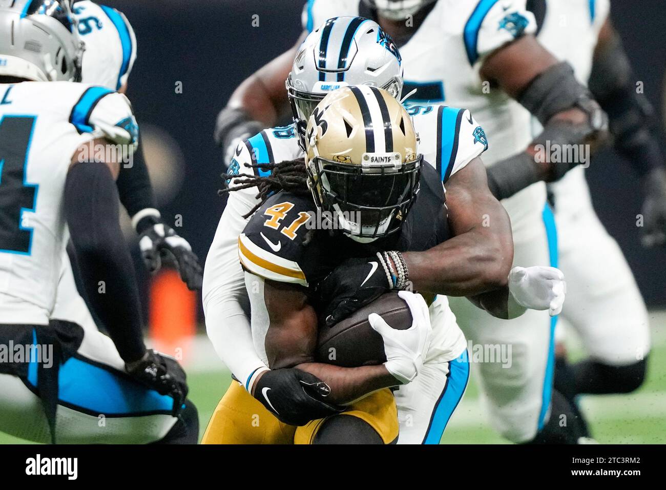 New Orleans Saints running back Alvin Kamara is tackled by Carolina ...