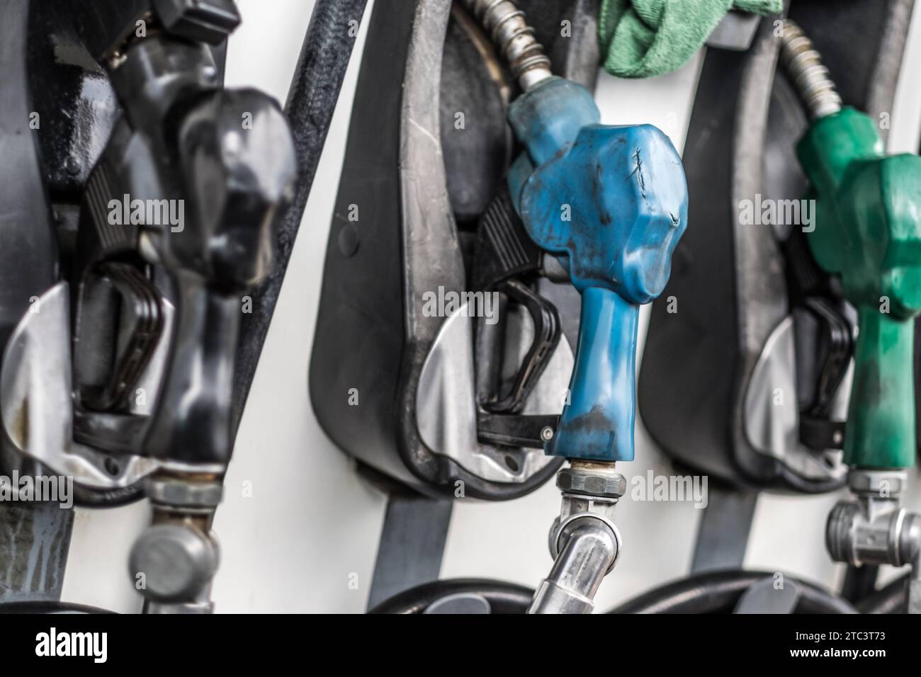 Gasoline and diesel pump nozzles in a gas station closeup. Filling gun ...
