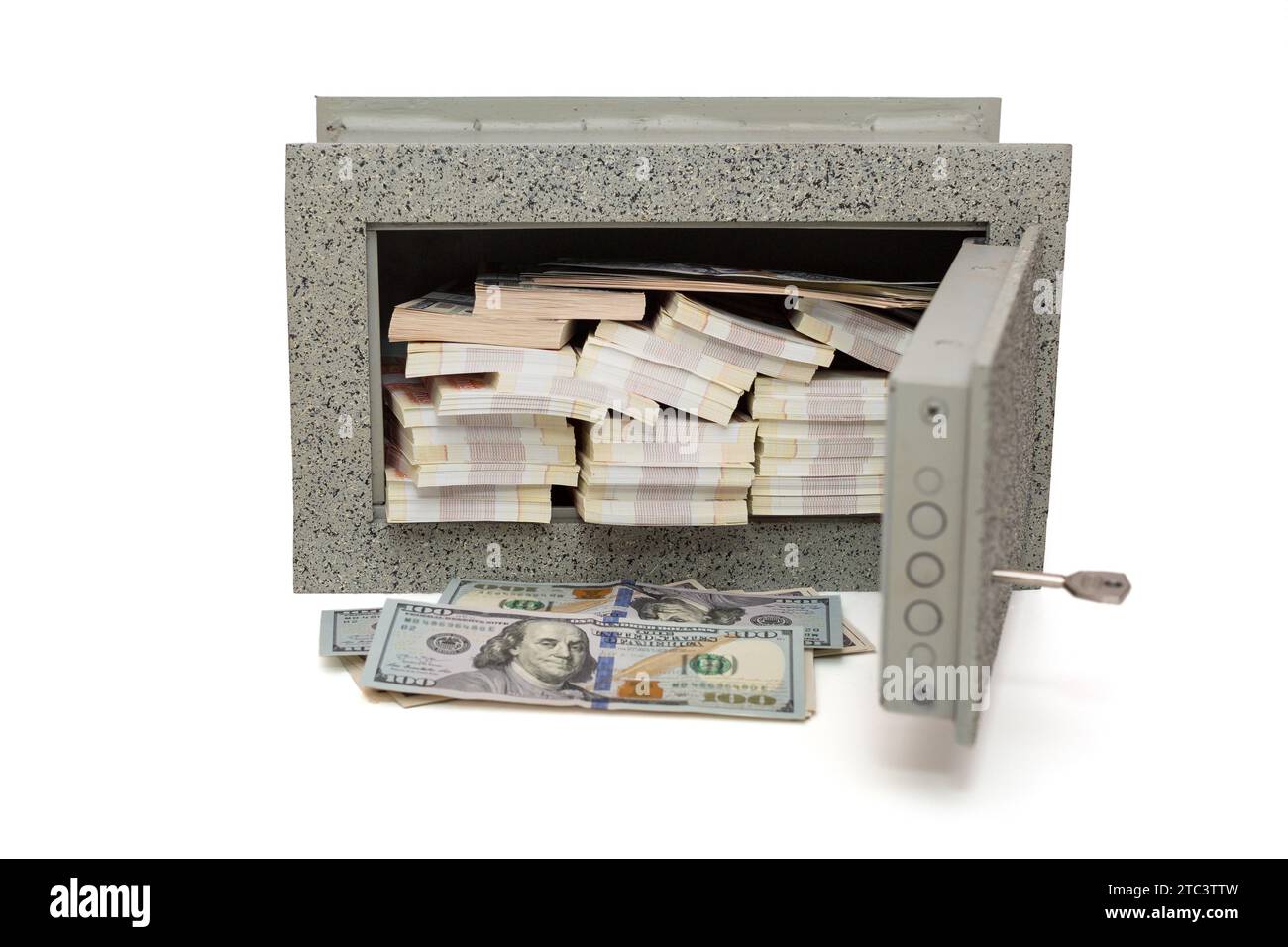 Small, home safe full of bundles of money in different currencies ...