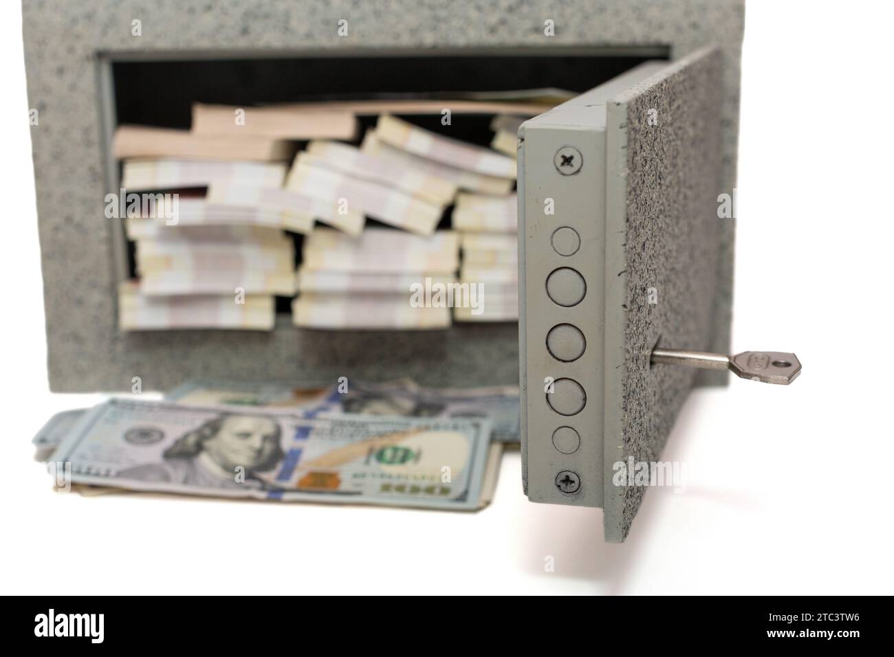 Small, home safe full of bundles of money in different currencies ...