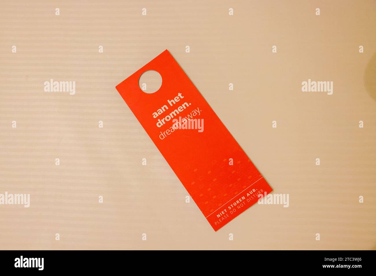 Red Do not disturb sign with text "Aan het dromen - Dream away" on a ...