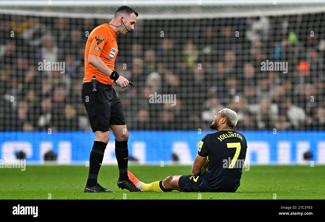 London, UK. 10th Dec, 2023. Chris Kavanagh (Referee) has a chat with ...