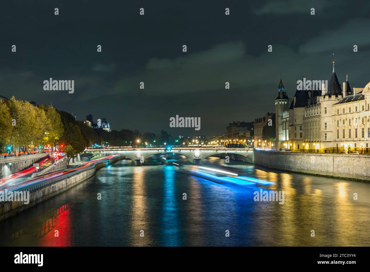 Paris, France. River Seine at night. Bridge au Change and City Palace ...