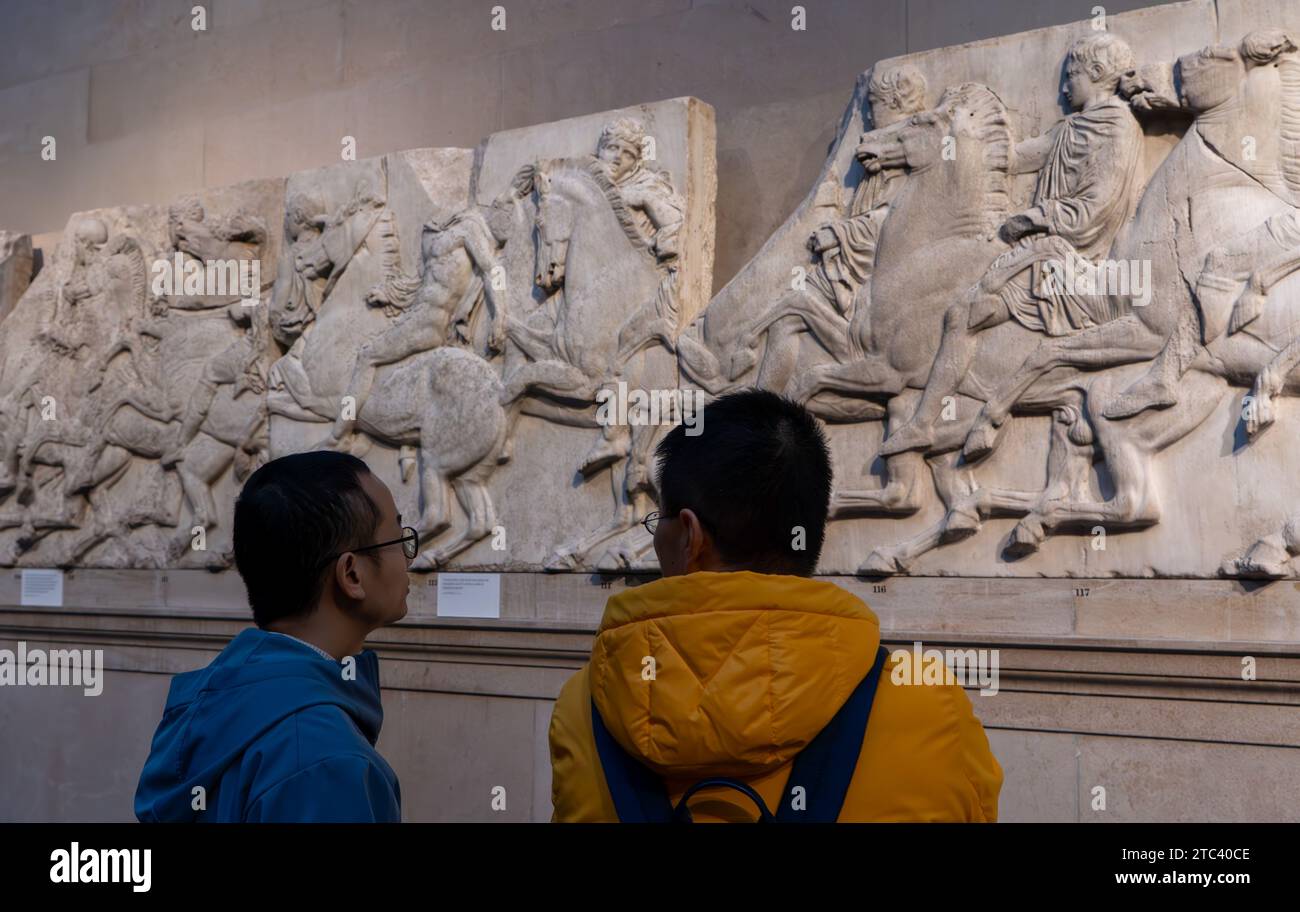 Visitors to the Elgin marbles from the Athens Parthenon gallery at the British Museum in London ...