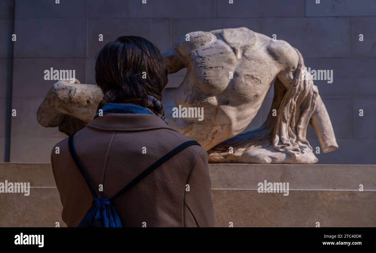 Visitors to the Elgin marbles from the Athens Parthenon gallery at the British Museum in London ...