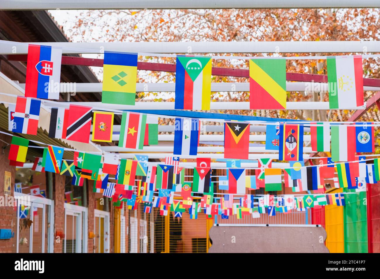 A variety of flags from many countries hang together in a children's ...